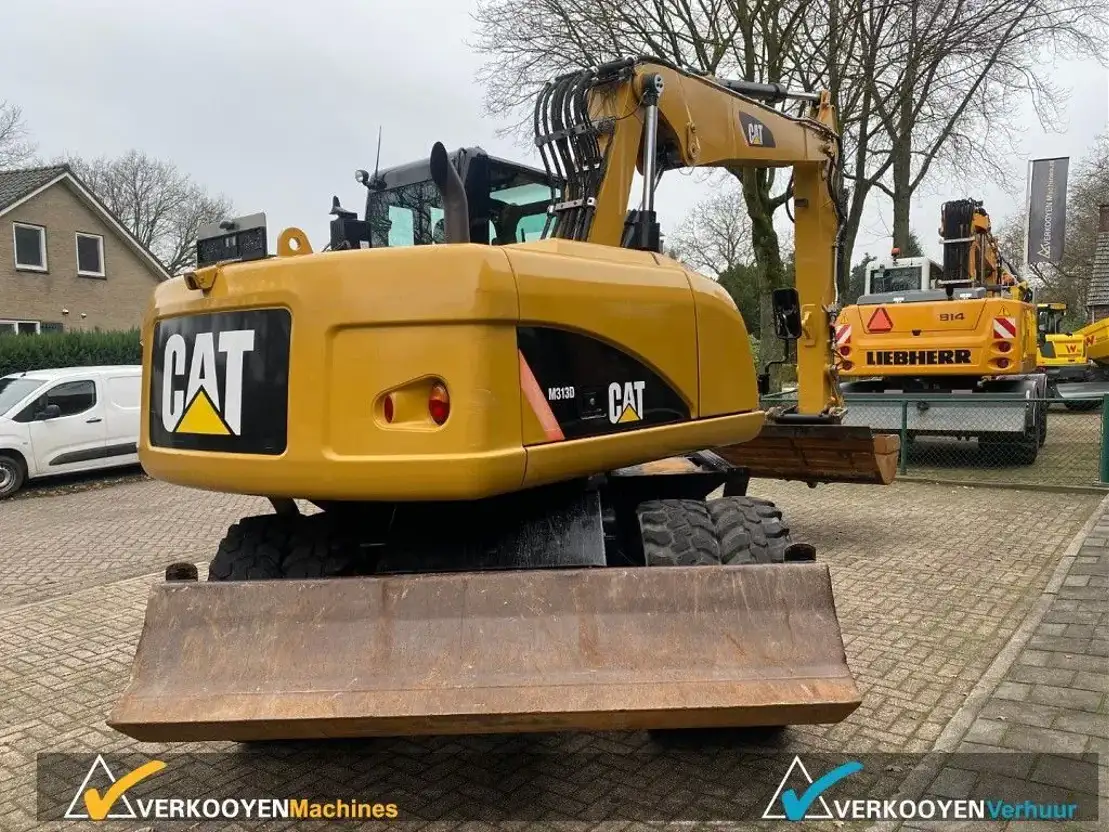 Caterpillar M313D | Wielgraafmachine - TrucksNL